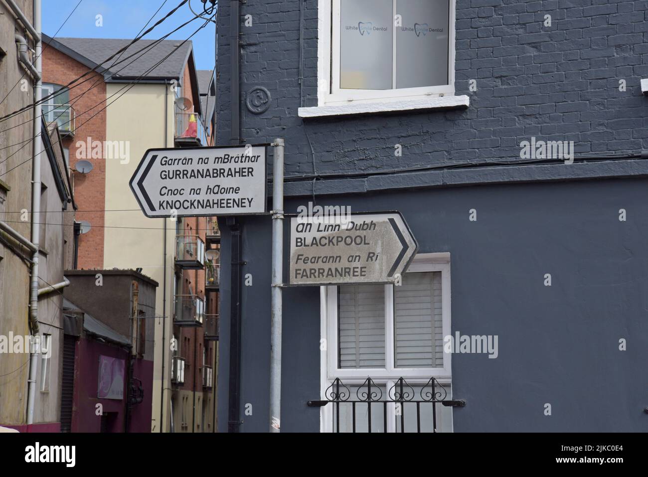 Bi Lingual road sign giving directions in Gaelic and English, in Cork ...