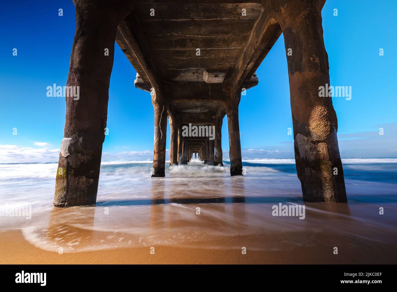 A scenic ocean view below Manhattan Beach pier in Los Angeles ...