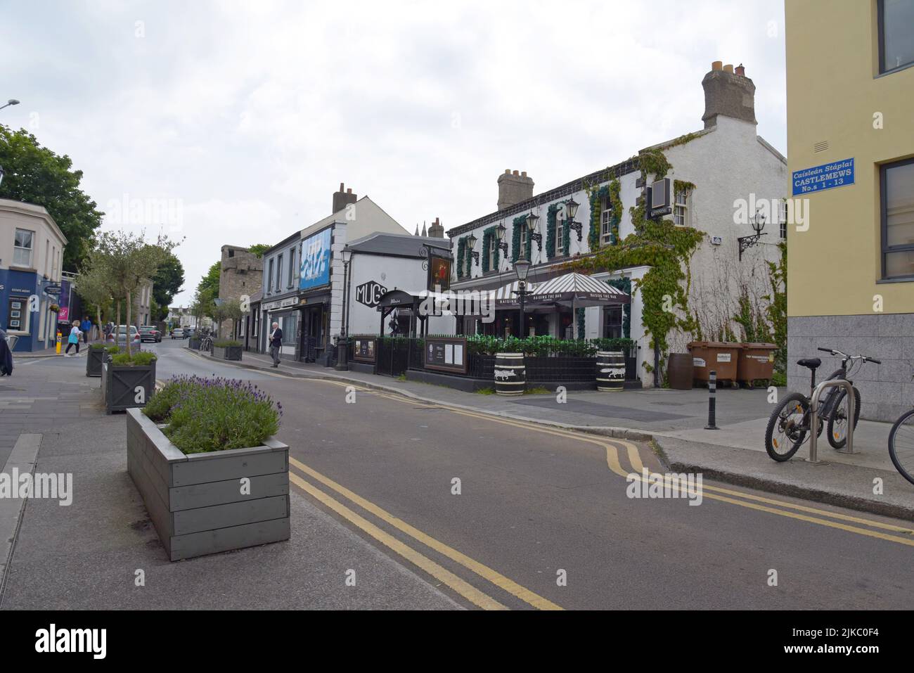 People browsing, shopping and dining in Castle Street, the main street ...