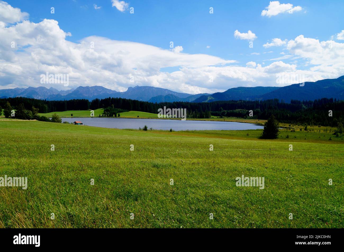 hiking trail overlooking scenic Attlesee in the Bavarian Alps ...