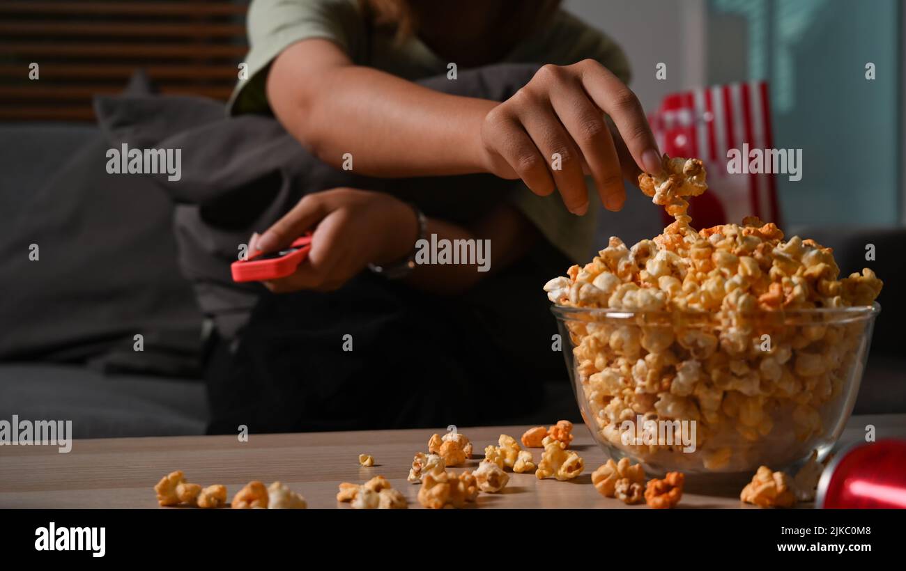 Grabbing popcorn hi-res stock photography and images - Alamy