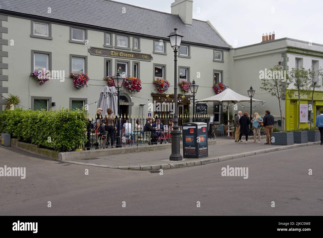 People browsing, shopping and dining in Castle Street, the main street ...
