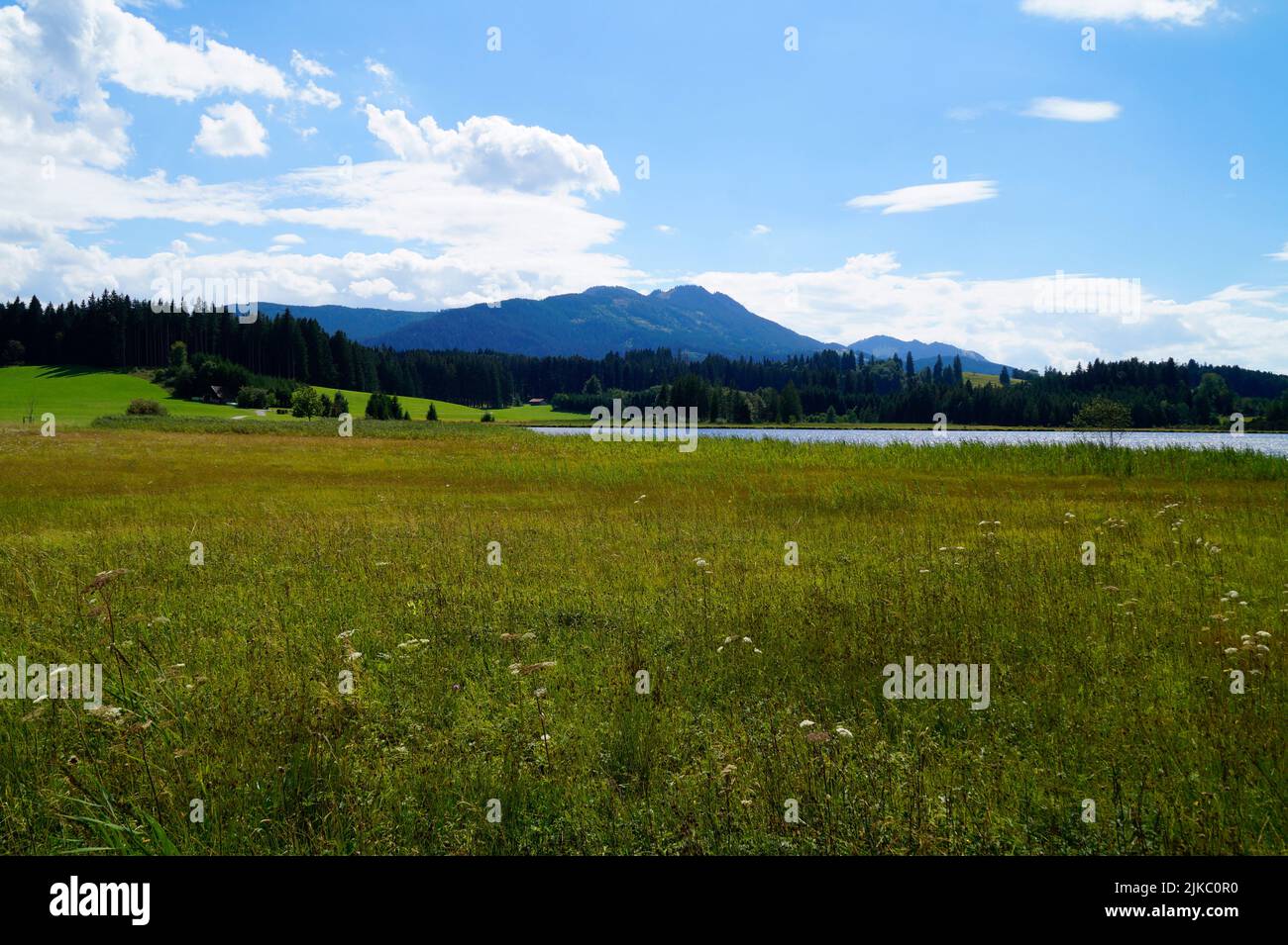hiking trail overlooking scenic Attlesee in the Bavarian Alps ...