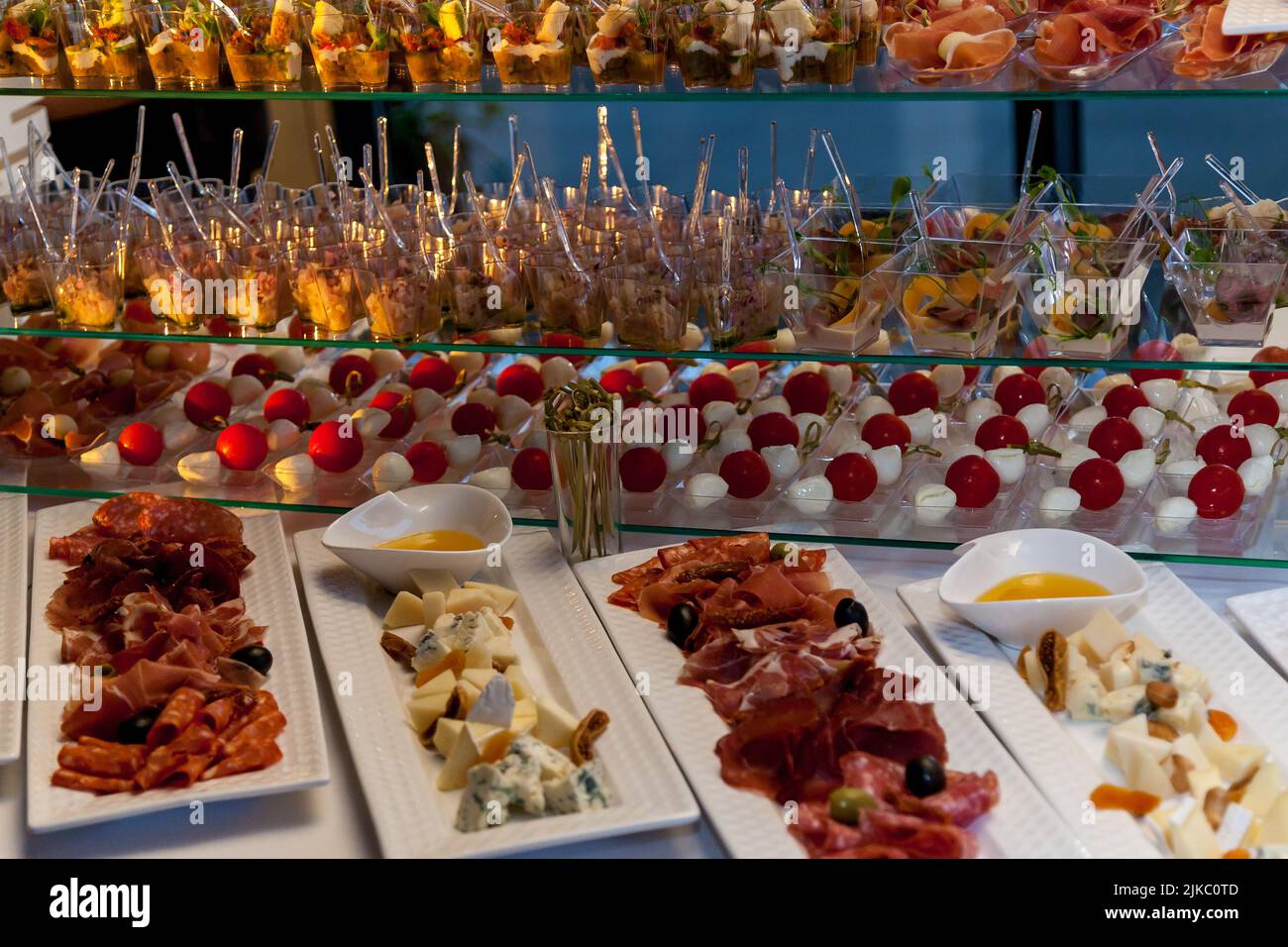 Catering service plate .appetizing sandwiches on plastic sticks ...