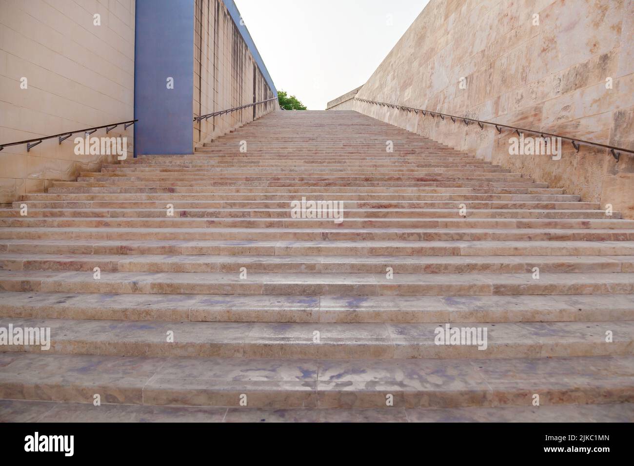 Modern wide stone staircase going up Stock Photo - Alamy