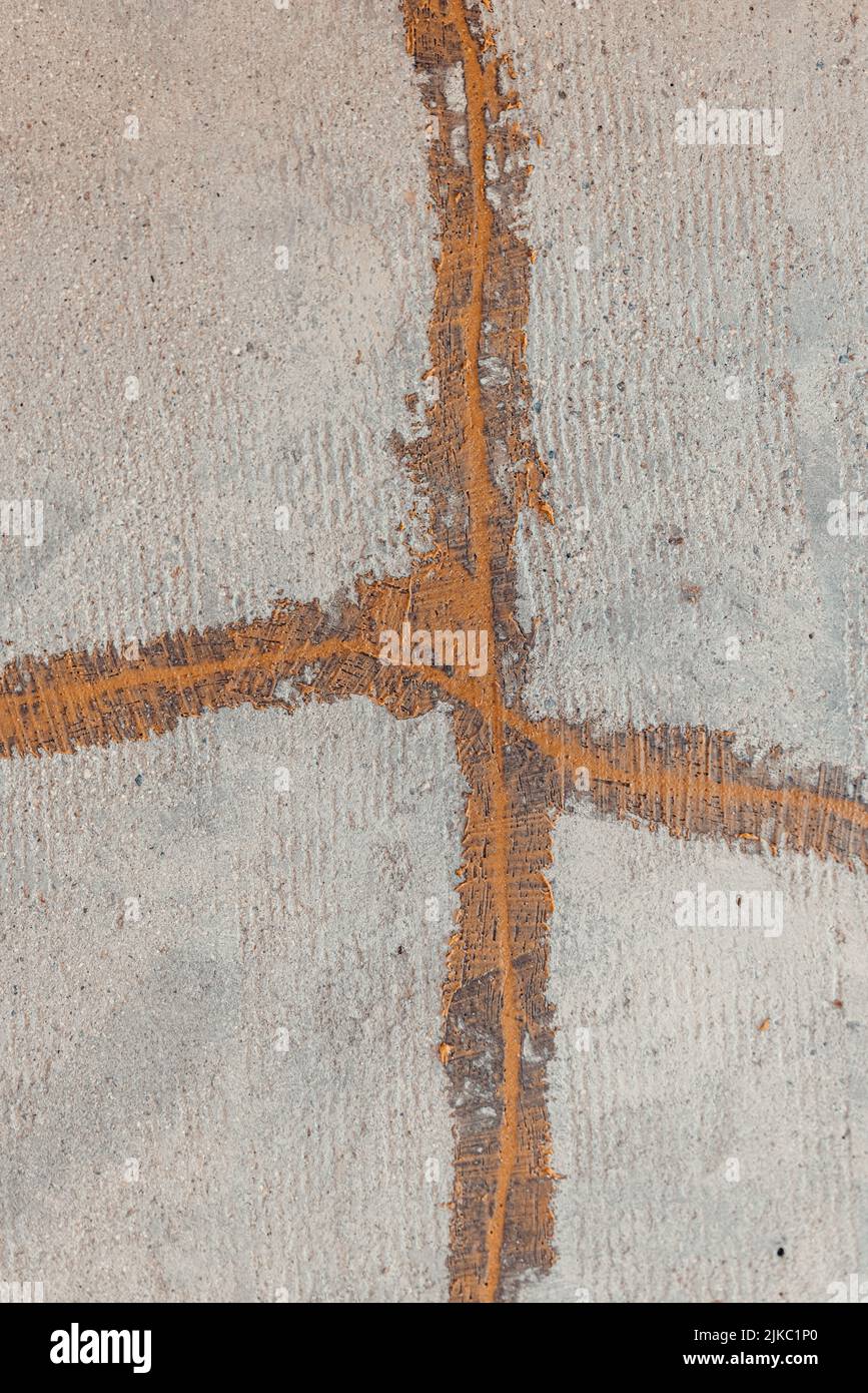 A top view of cracks repaired with epoxy mortar on the freshly sanded ...