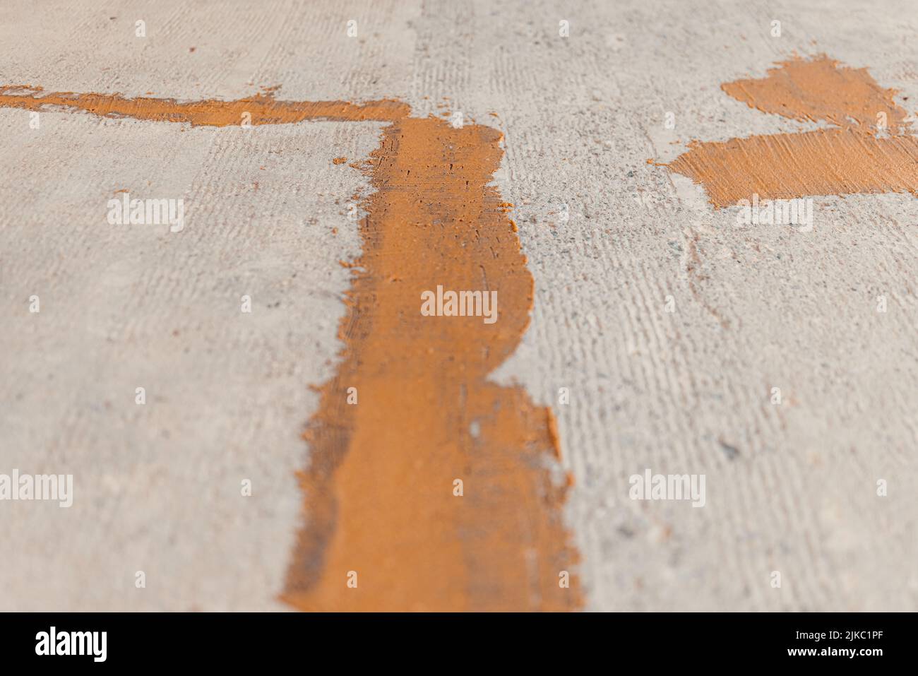 A view of cracks repaired with epoxy mortar on the freshly sanded ...