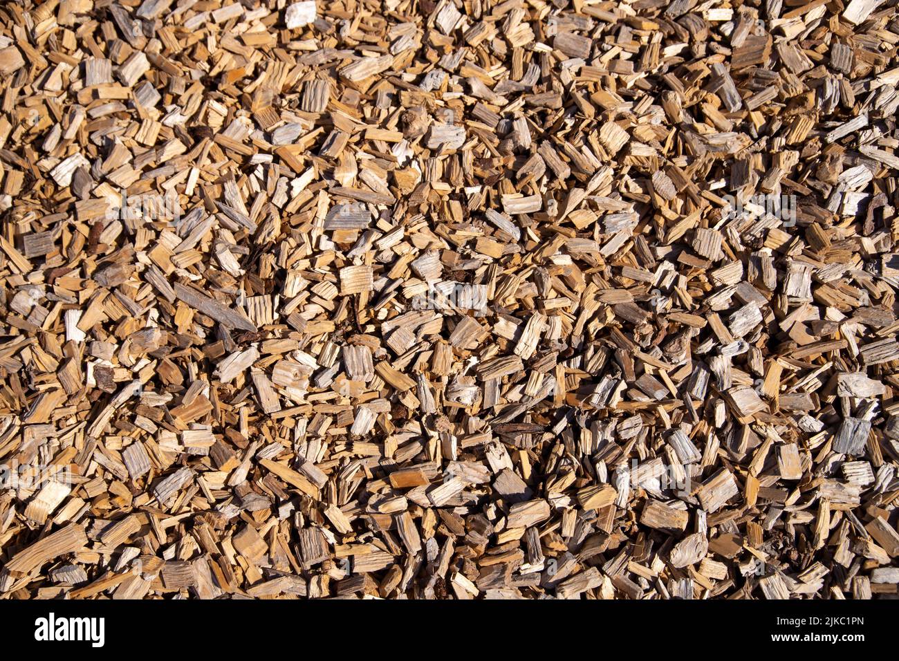 A top view of the texture of small pieces of wood, brown wood chips ...