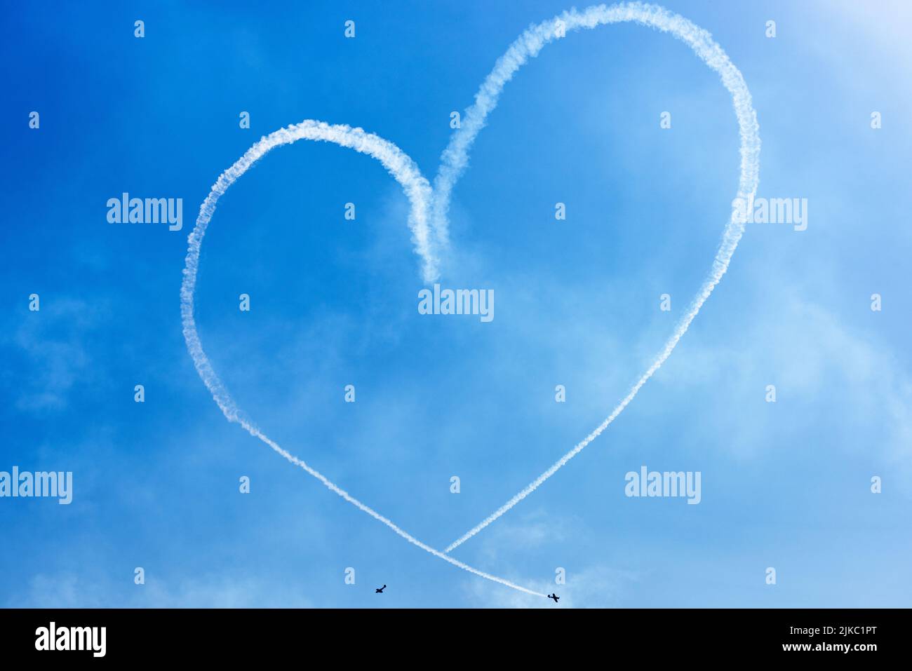 Two Light Airplanes In The Sky Writing Romantic Heart Shape Stock Photo ...