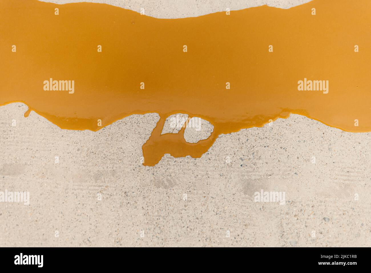 A top view of epoxy resin poured on the freshly sanded concrete floor ...