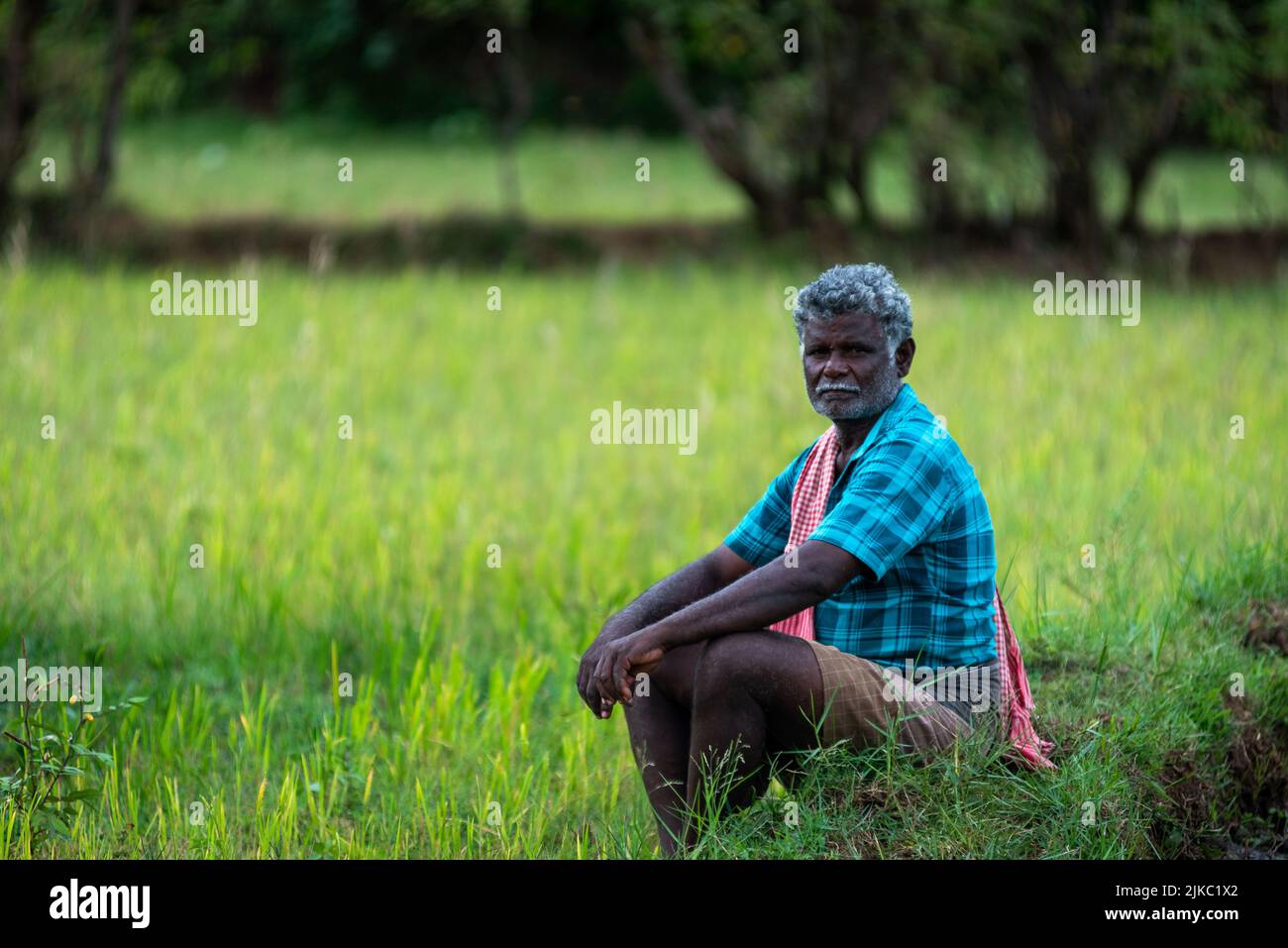 An Indian farmer resting after a day's worth of hard labour Stock Photo ...