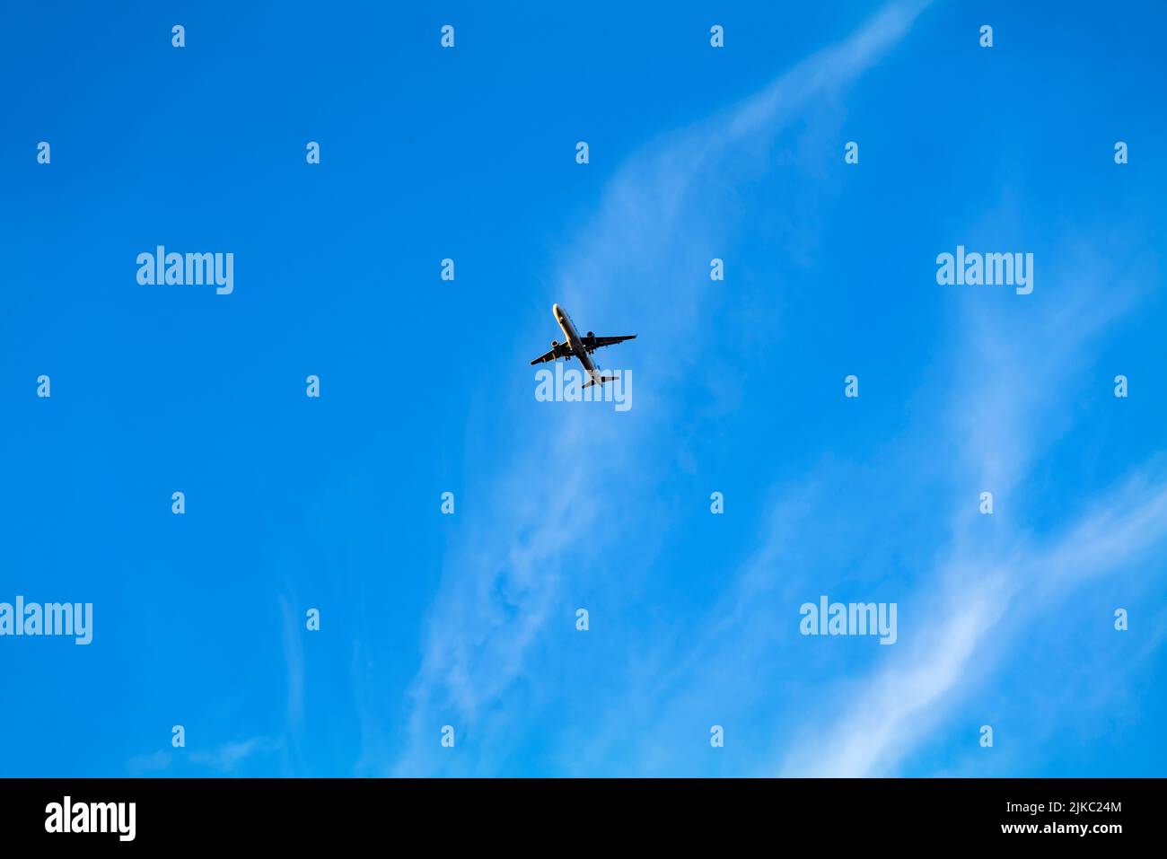 Low angle view of airplane against the sky with space for text Stock ...