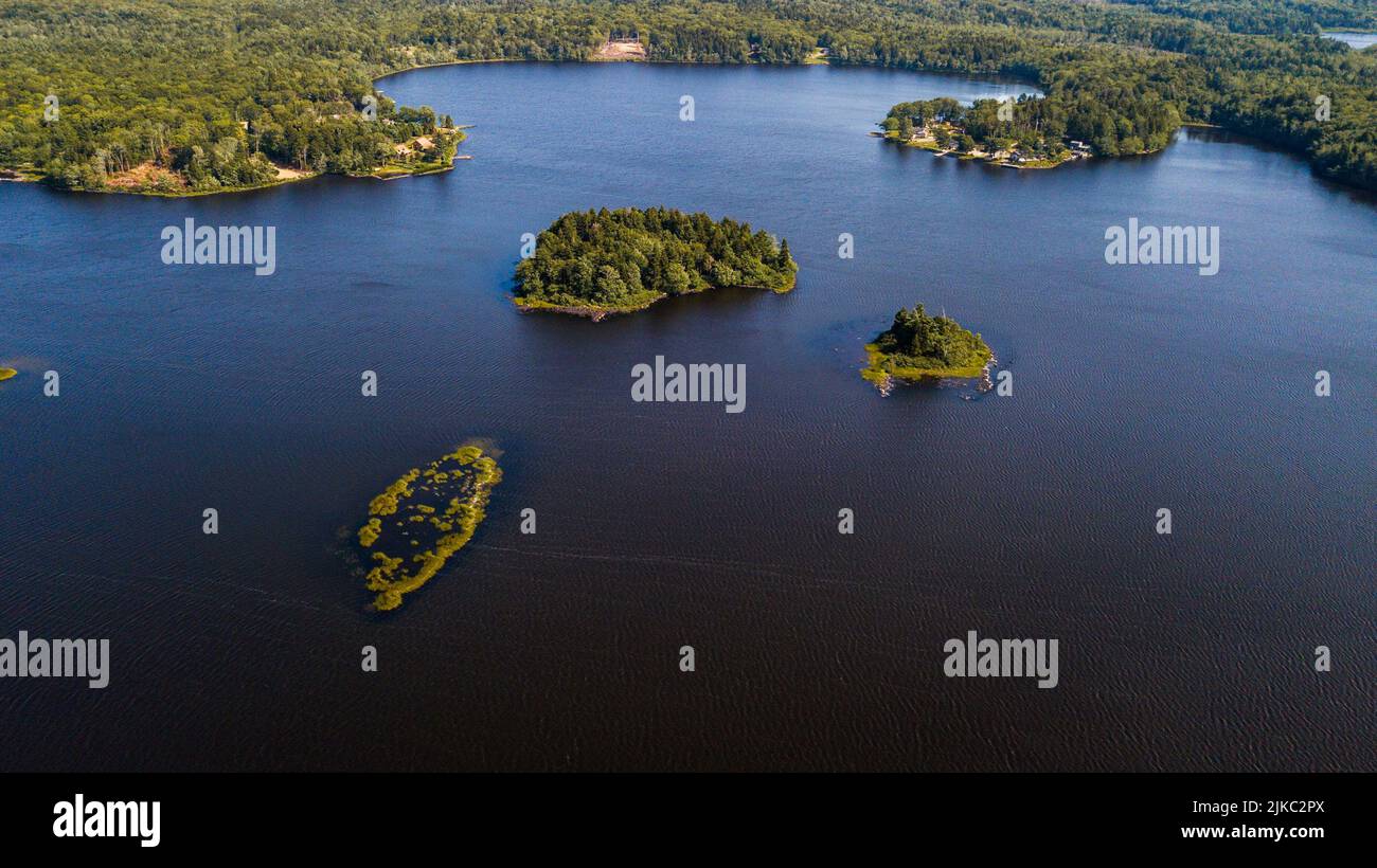 A beautiful drone view of most picturesque lake with dense forests of ...