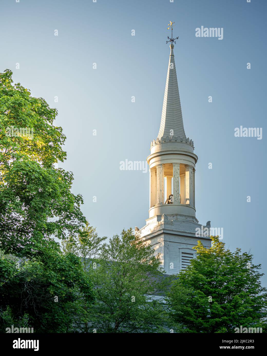 A vertical shot of the spire of the First Parish Church in Waltham ...