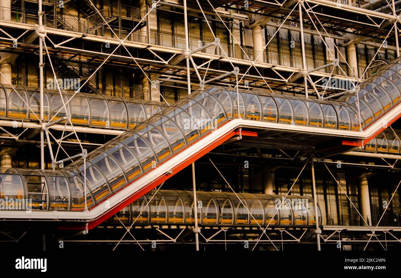 a closeup of the Facade and exterior escalator of the Pompidou Centre ...