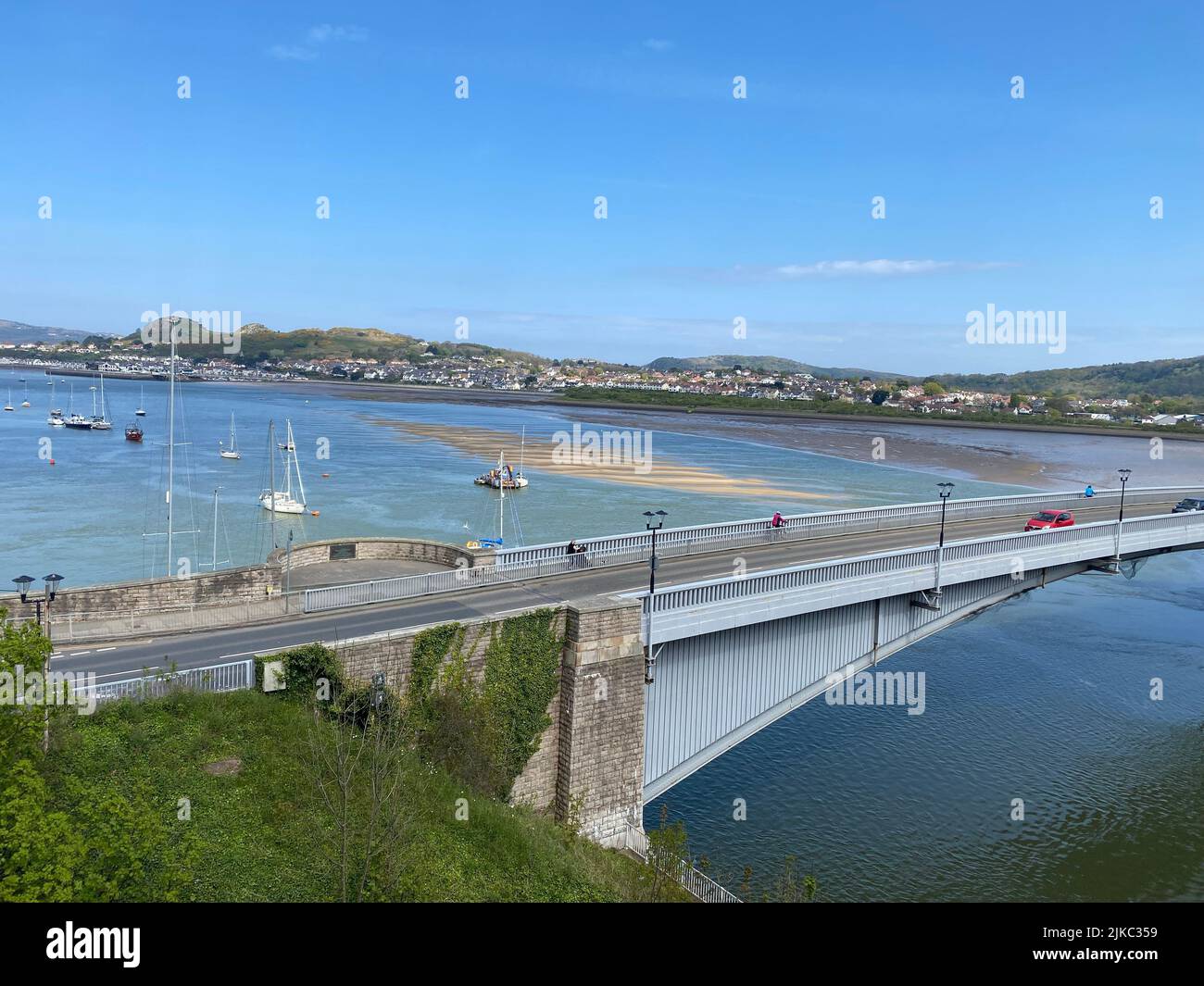 A bridge over a river with ships Stock Photo - Alamy
