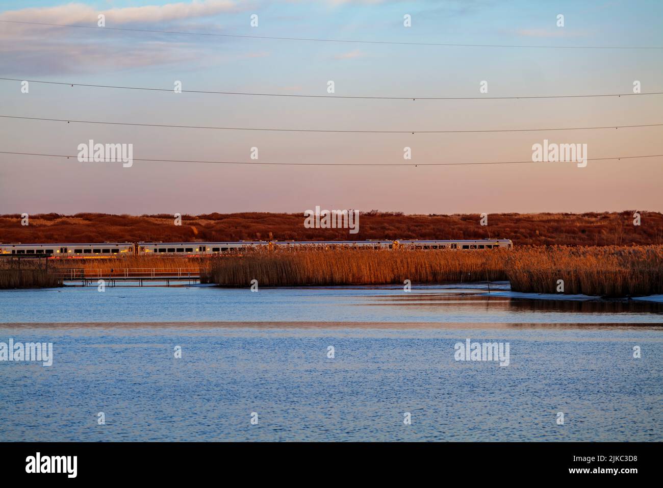 Railroad Tracks Against Sky During Sunset with blue sky, electric ...
