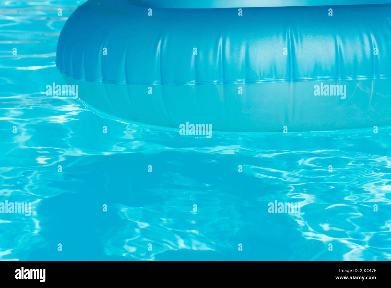Blue summer pool rubber ring floating on a vacation swimming pool Stock ...