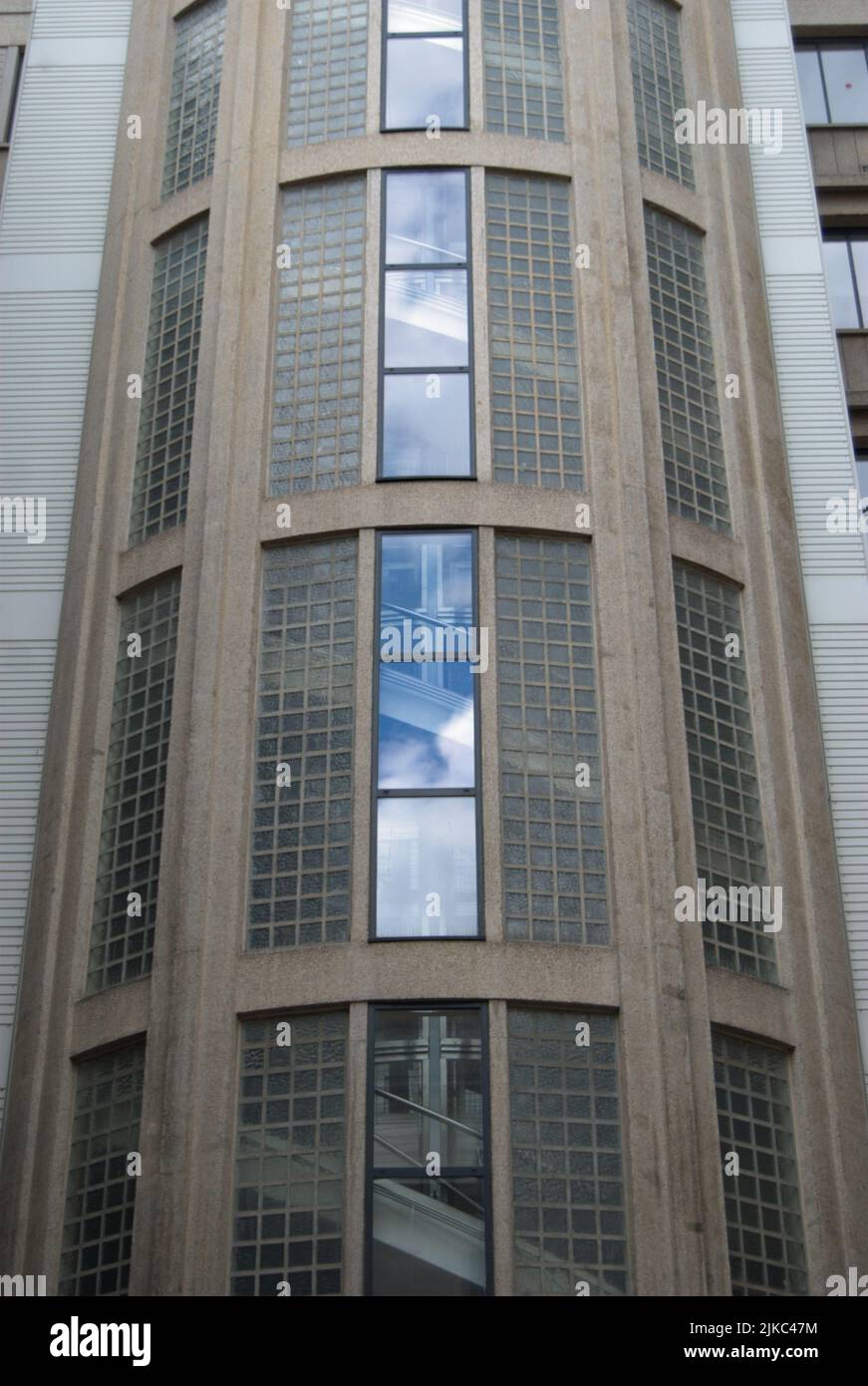A vertical close-up shot of a building with panoramic windows Stock ...
