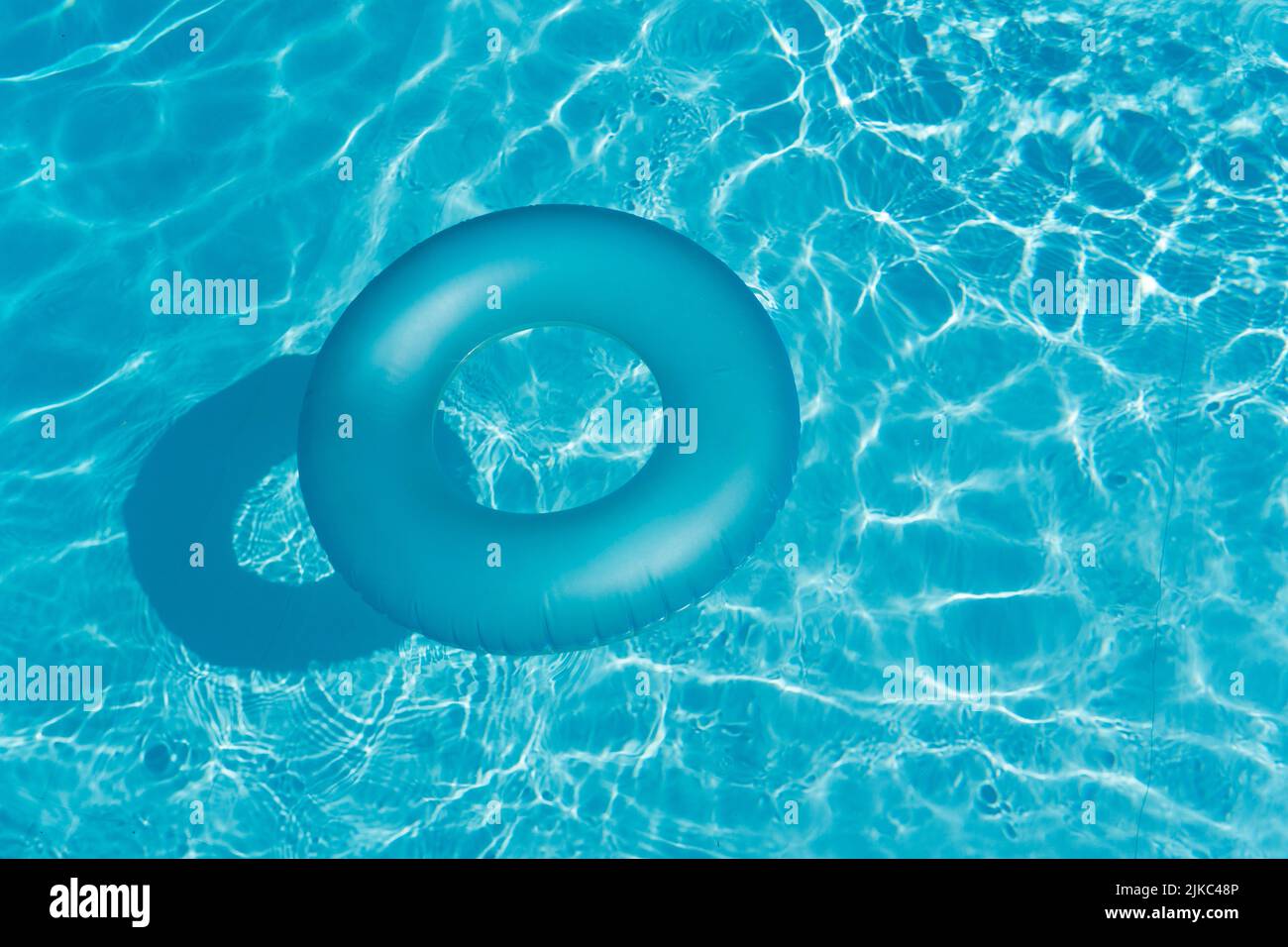 Blue summer pool rubber ring floating on a vacation swimming pool Stock ...