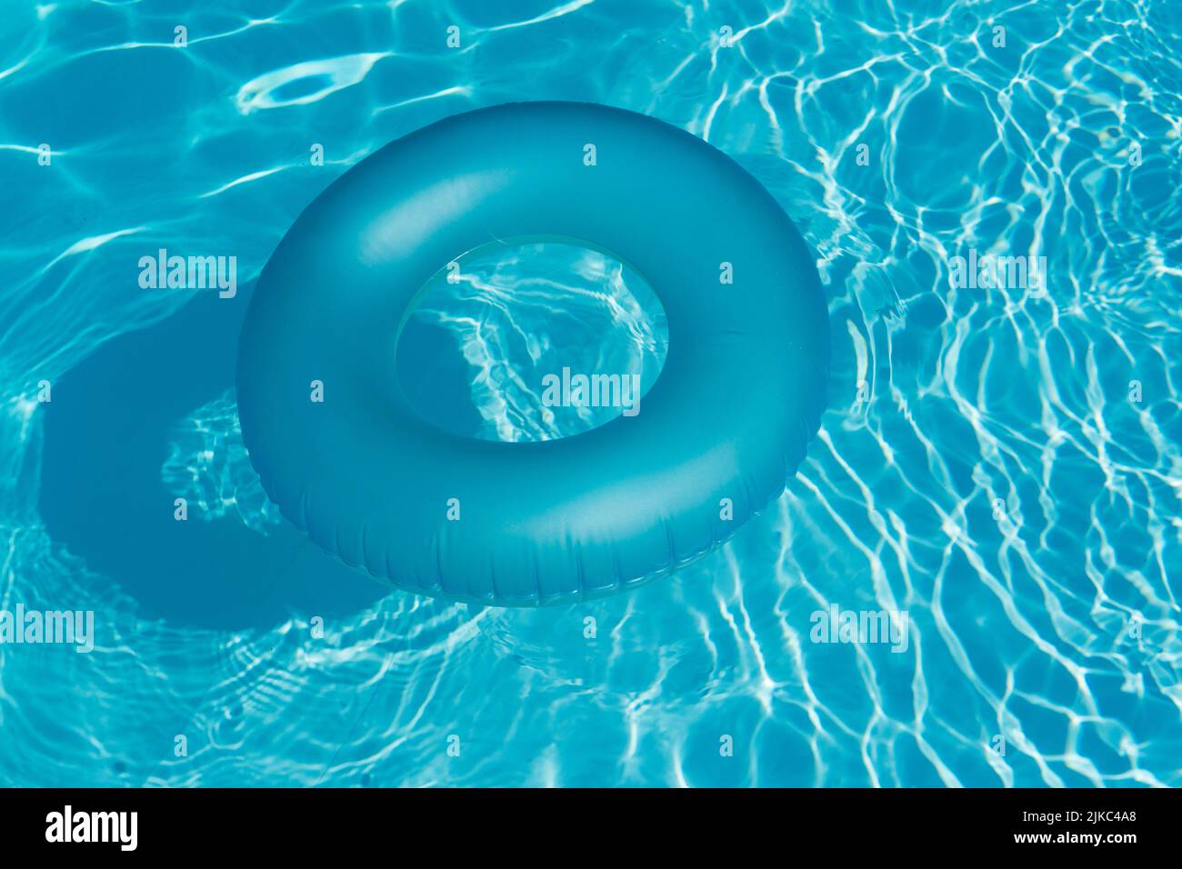 Blue summer pool rubber ring floating on a vacation swimming pool Stock ...