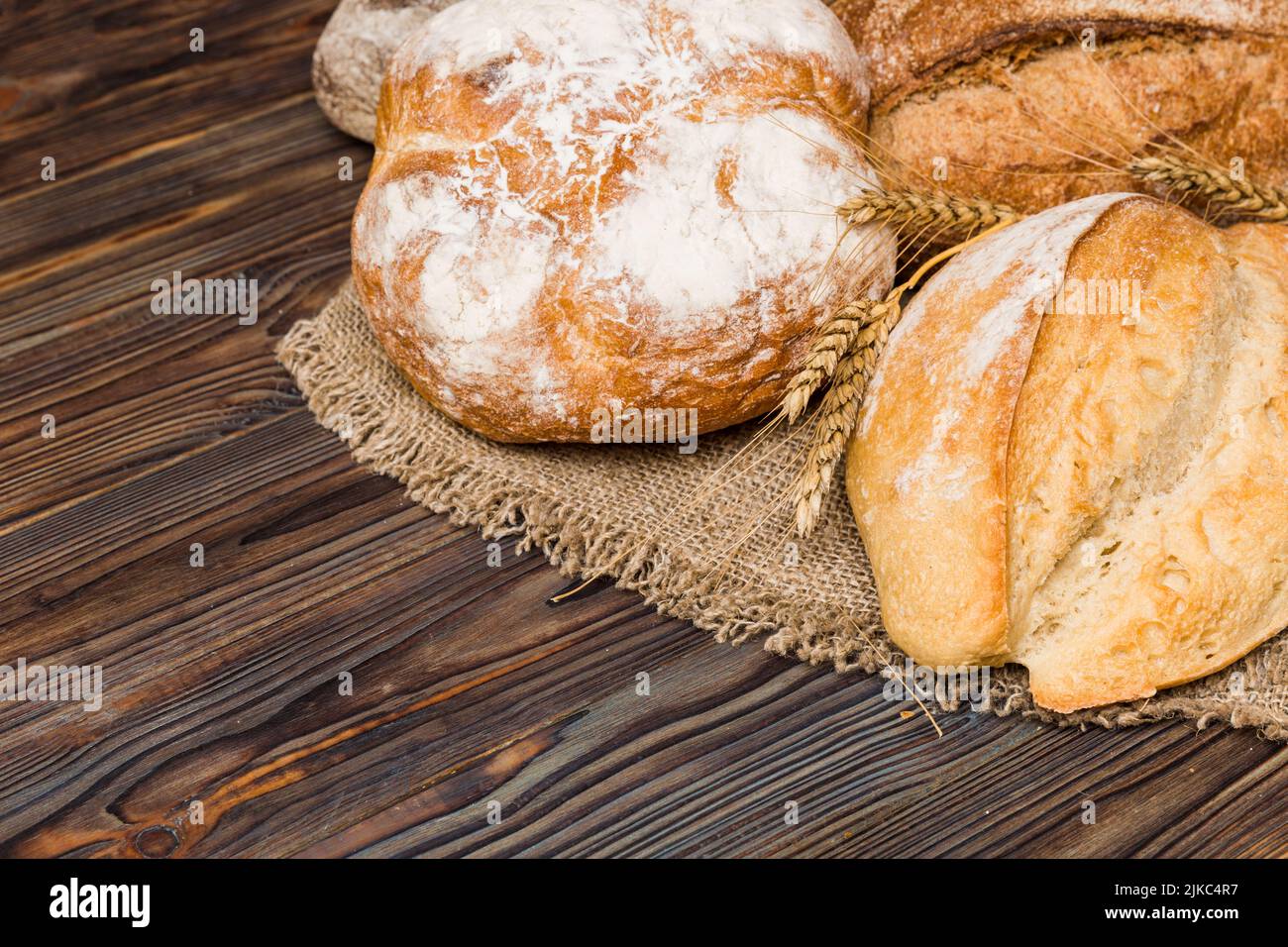 Homemade natural breads. Different kinds of fresh bread as background ...