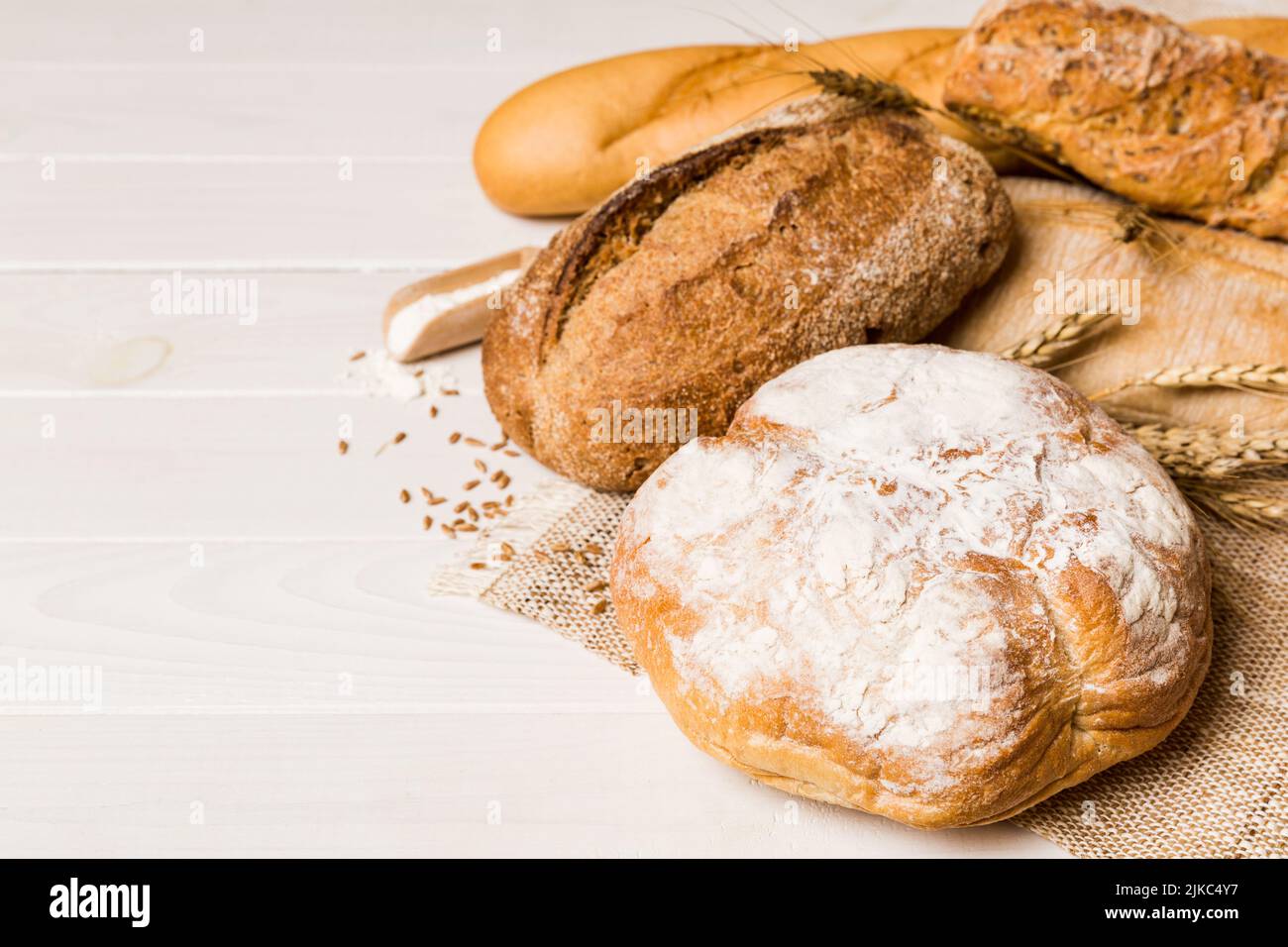 Homemade natural breads. Different kinds of fresh bread as background ...