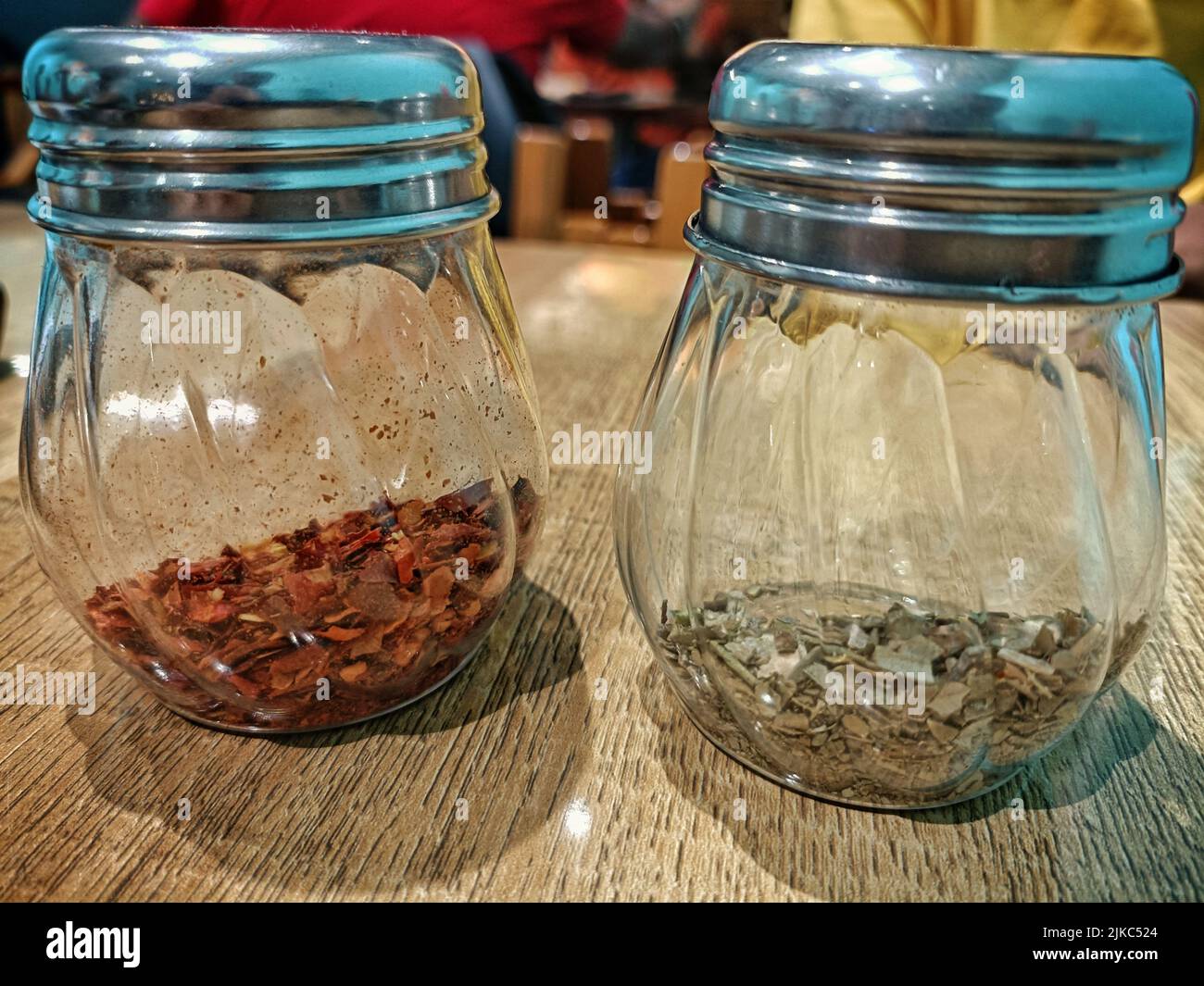 Condiments for pizza like red flakes and cheese flakes Stock Photo - Alamy
