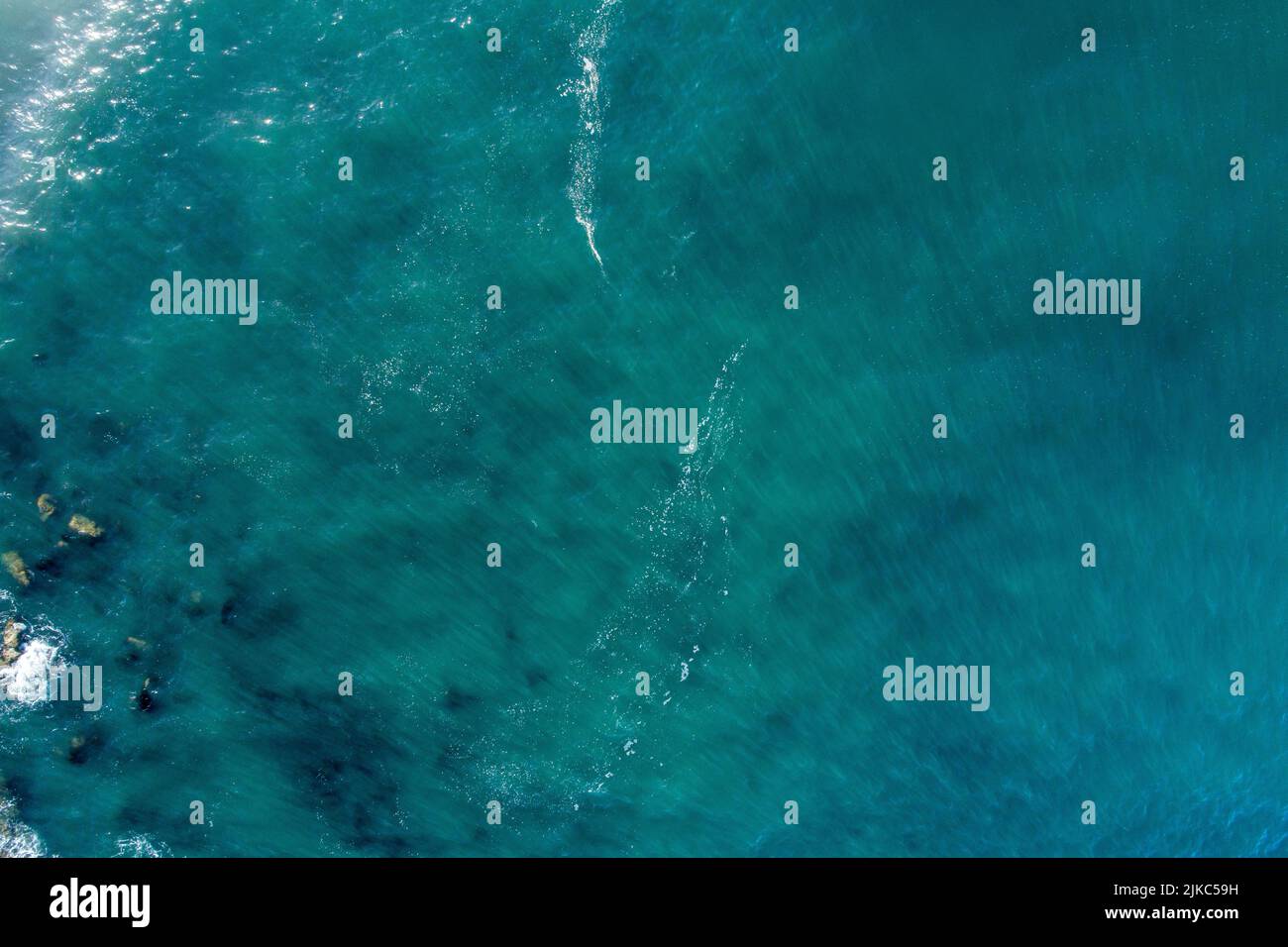 Aerial top view of green ocean surface background Stock Photo - Alamy