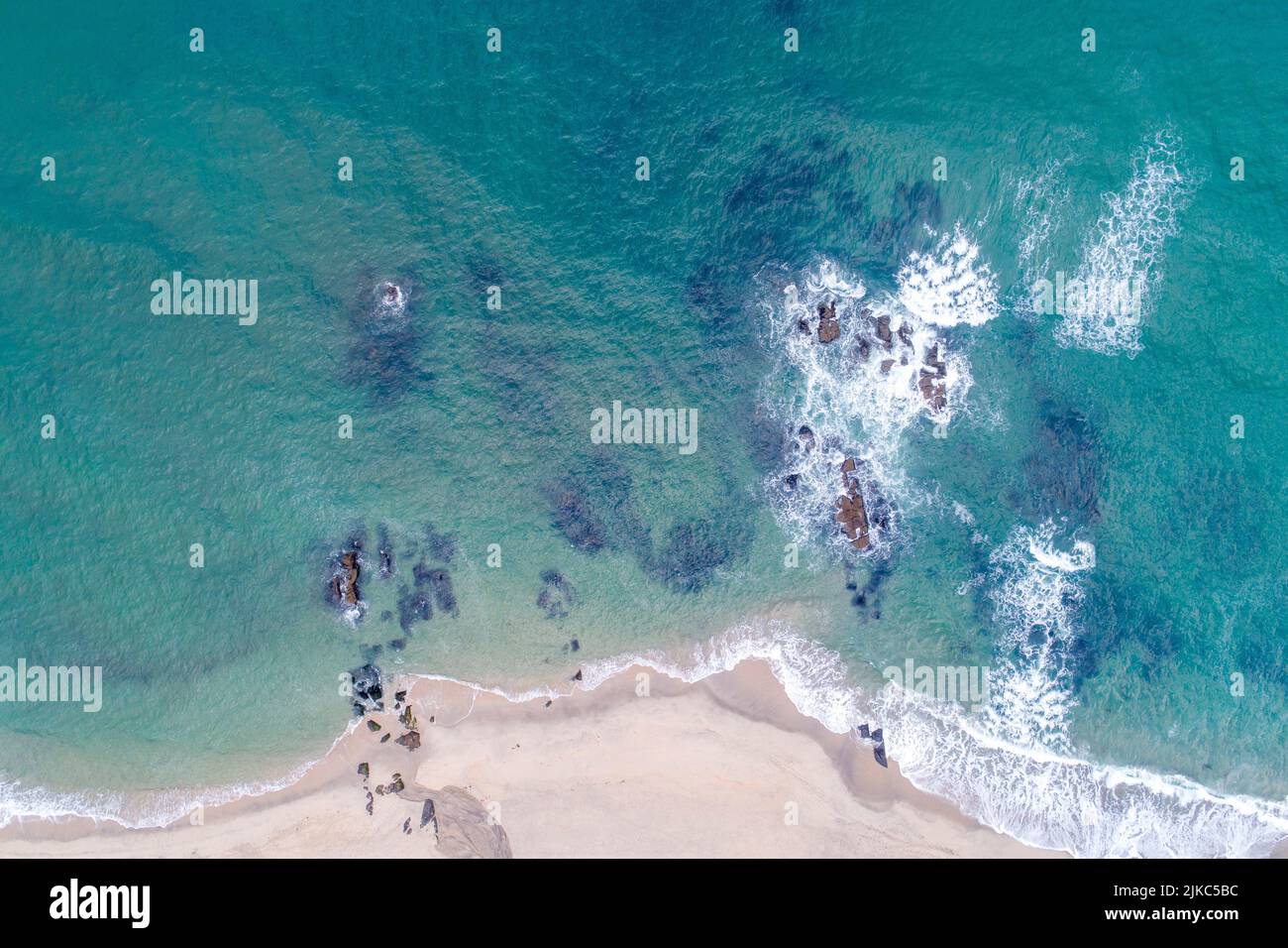 Drone aerial view of a beach with a small water stream Stock Photo - Alamy