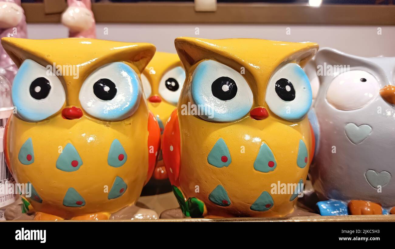A Closeup view of Ceramic Owl toys for display in Racks in a shopping ...