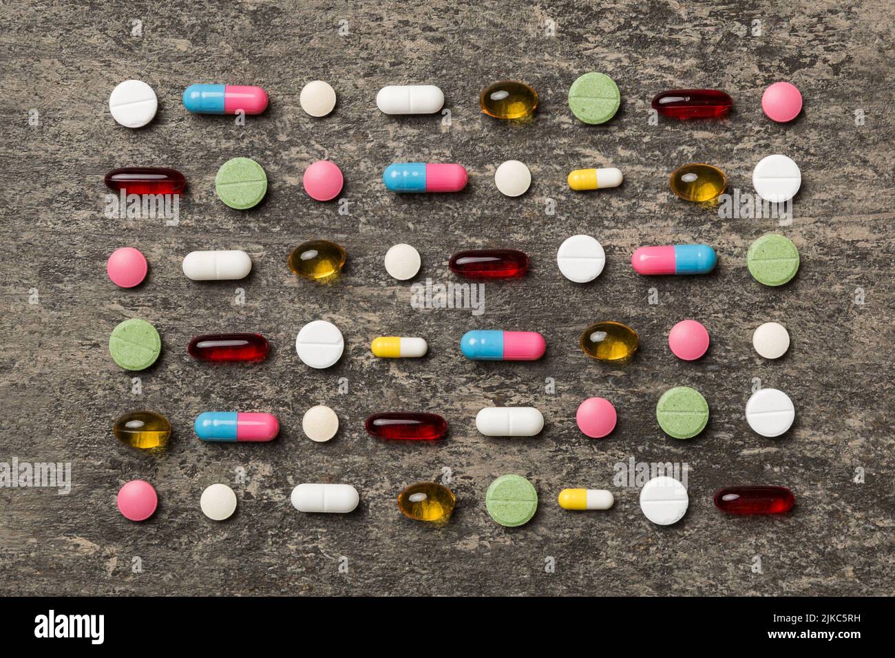 Many different pills and space for text on colorful background, top ...