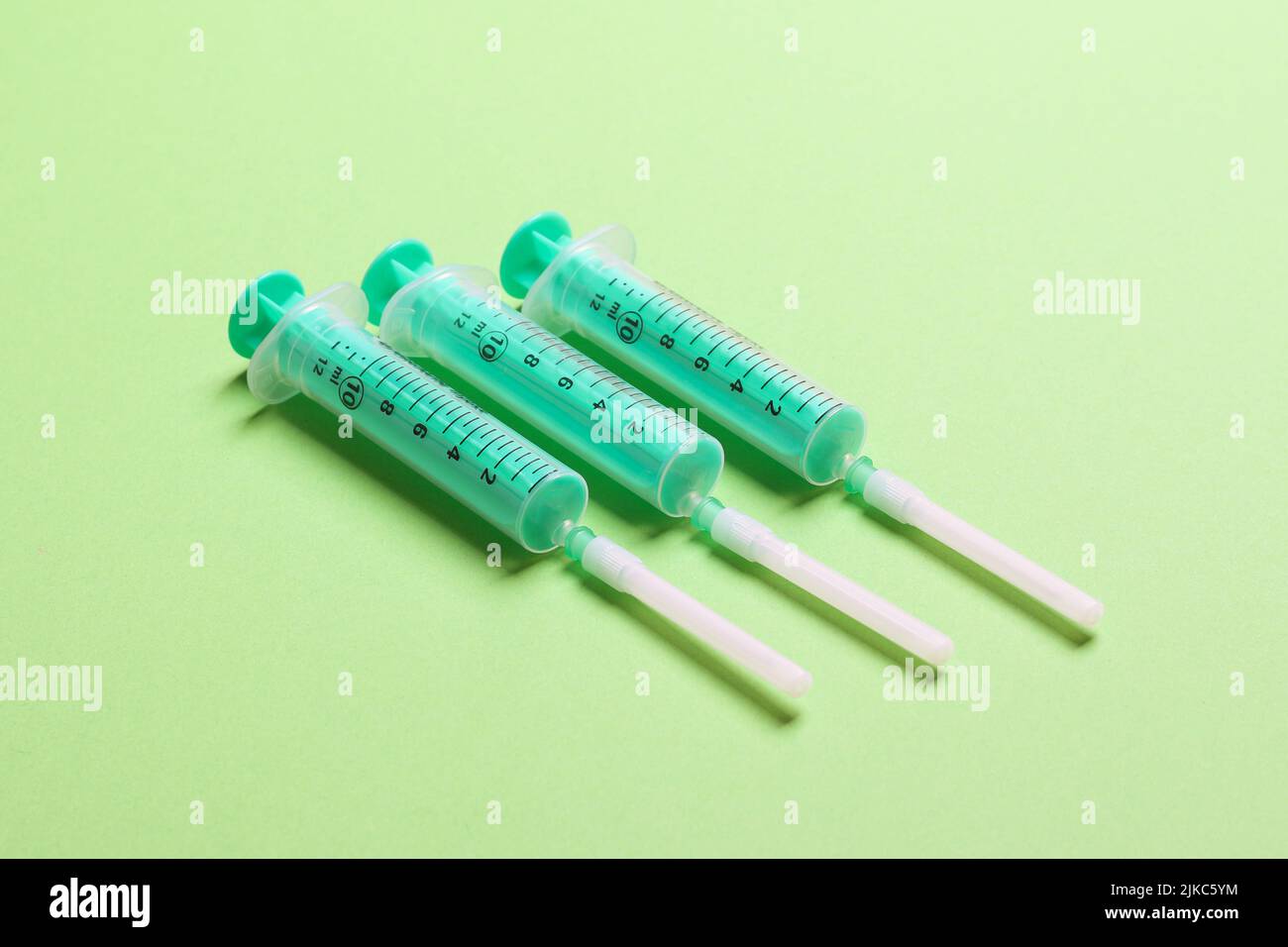 Top view of different syringes for injection on colorful background ...