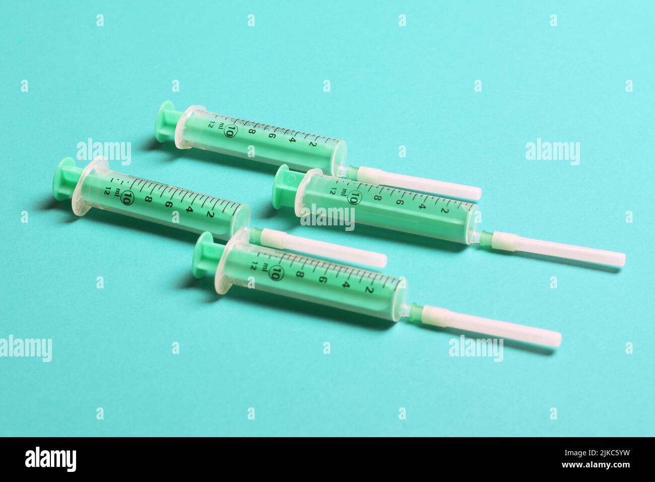 Top view of syringes in a row for medical injection on colorful ...