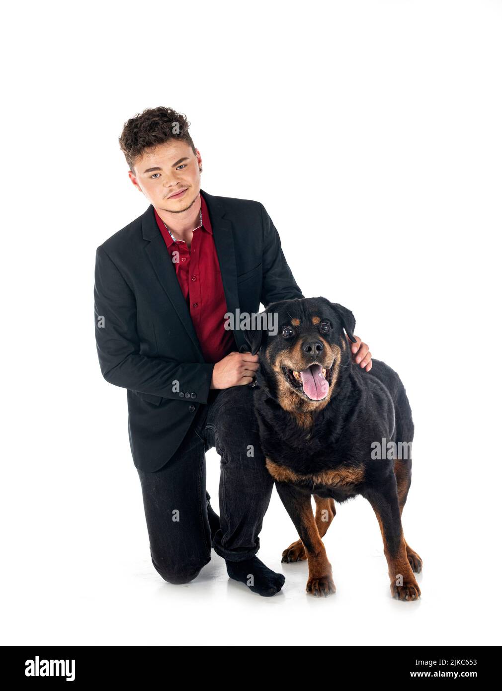 purebred old rottweiler fourteen year and his owner in front of white ...