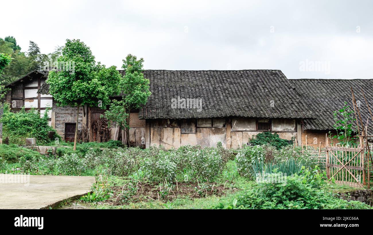 The facade of an old poor house in a village in the daytime Stock Photo ...