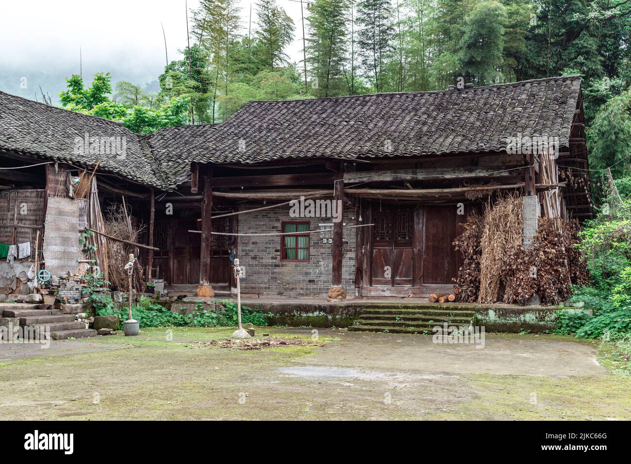 The facade of an old poor house in a village in the daytime Stock Photo ...