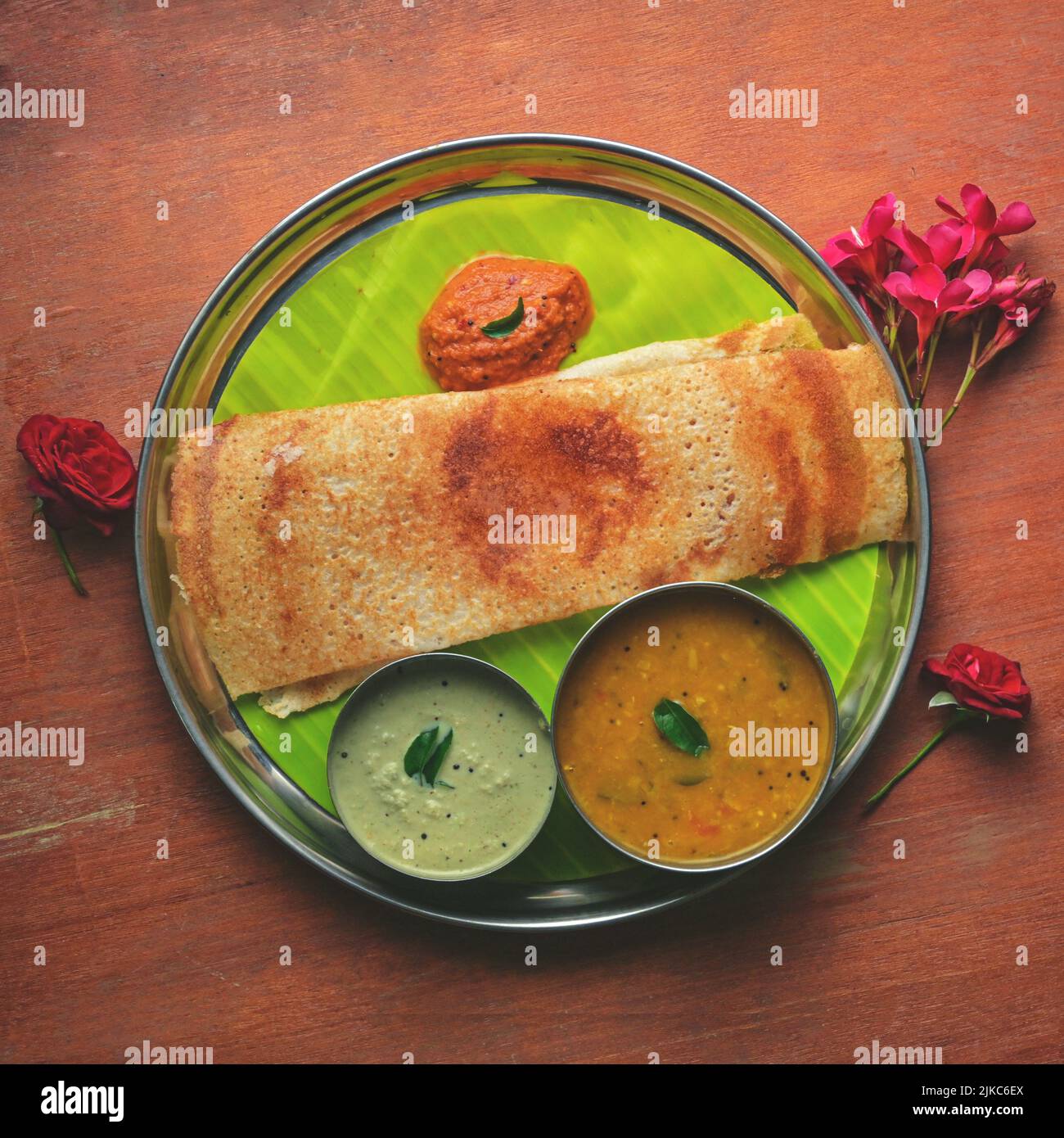 A top view of dosa served with aloo rasedar and sauce on a tray Stock ...
