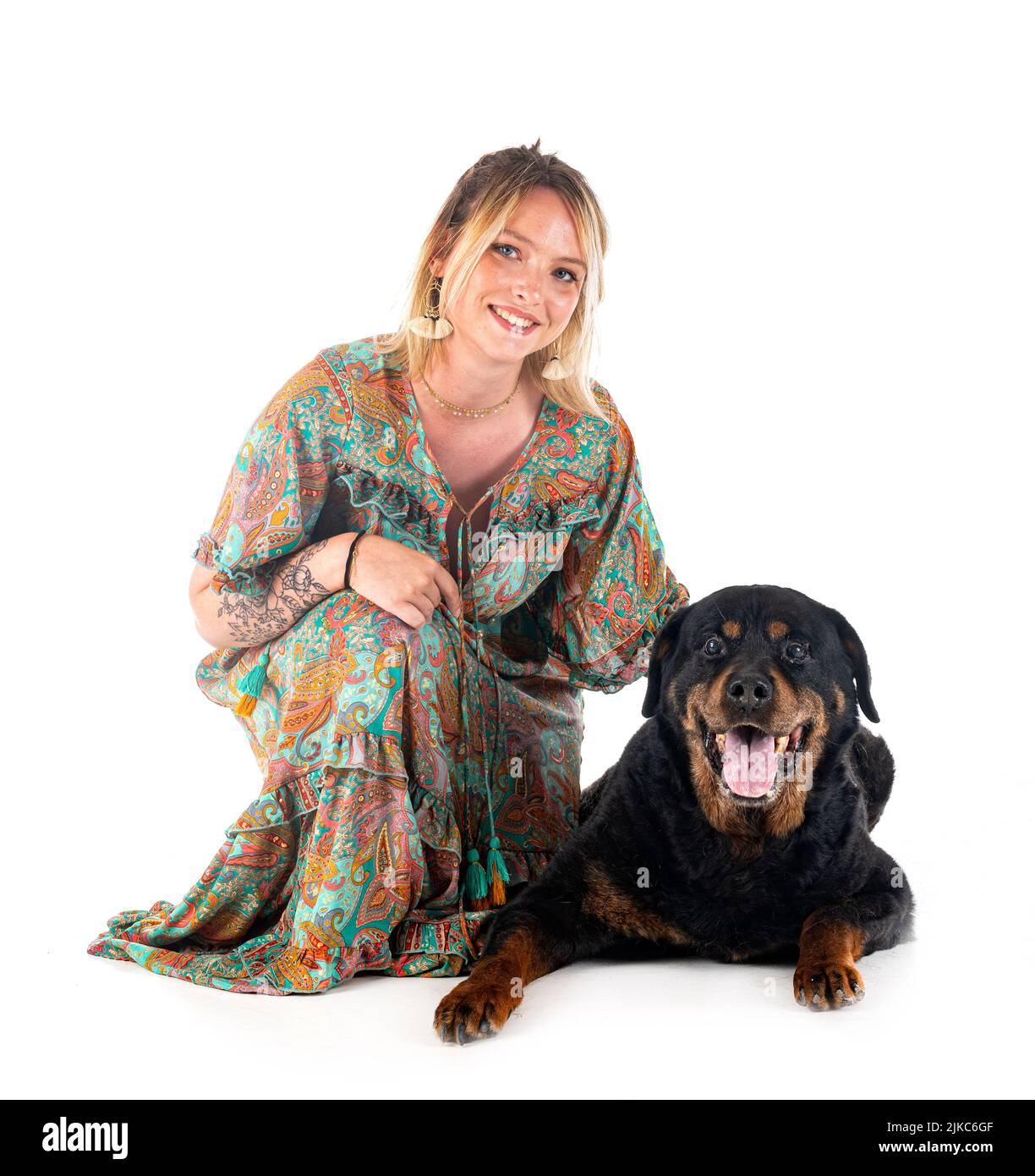 purebred old rottweiler fourteen year and his owner in front of white ...