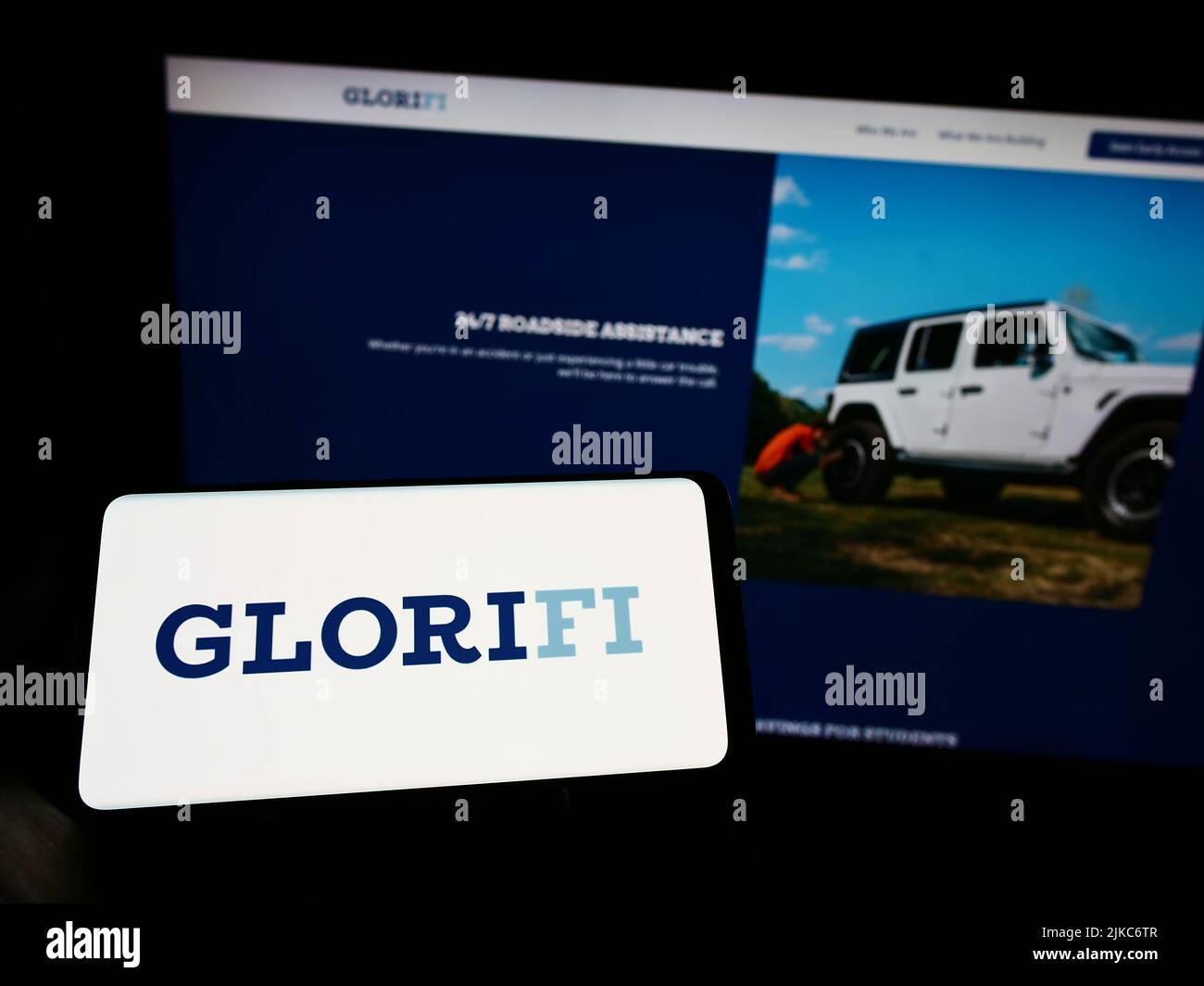 Person holding cellphone with logo of company Animo Mortgage Company ...