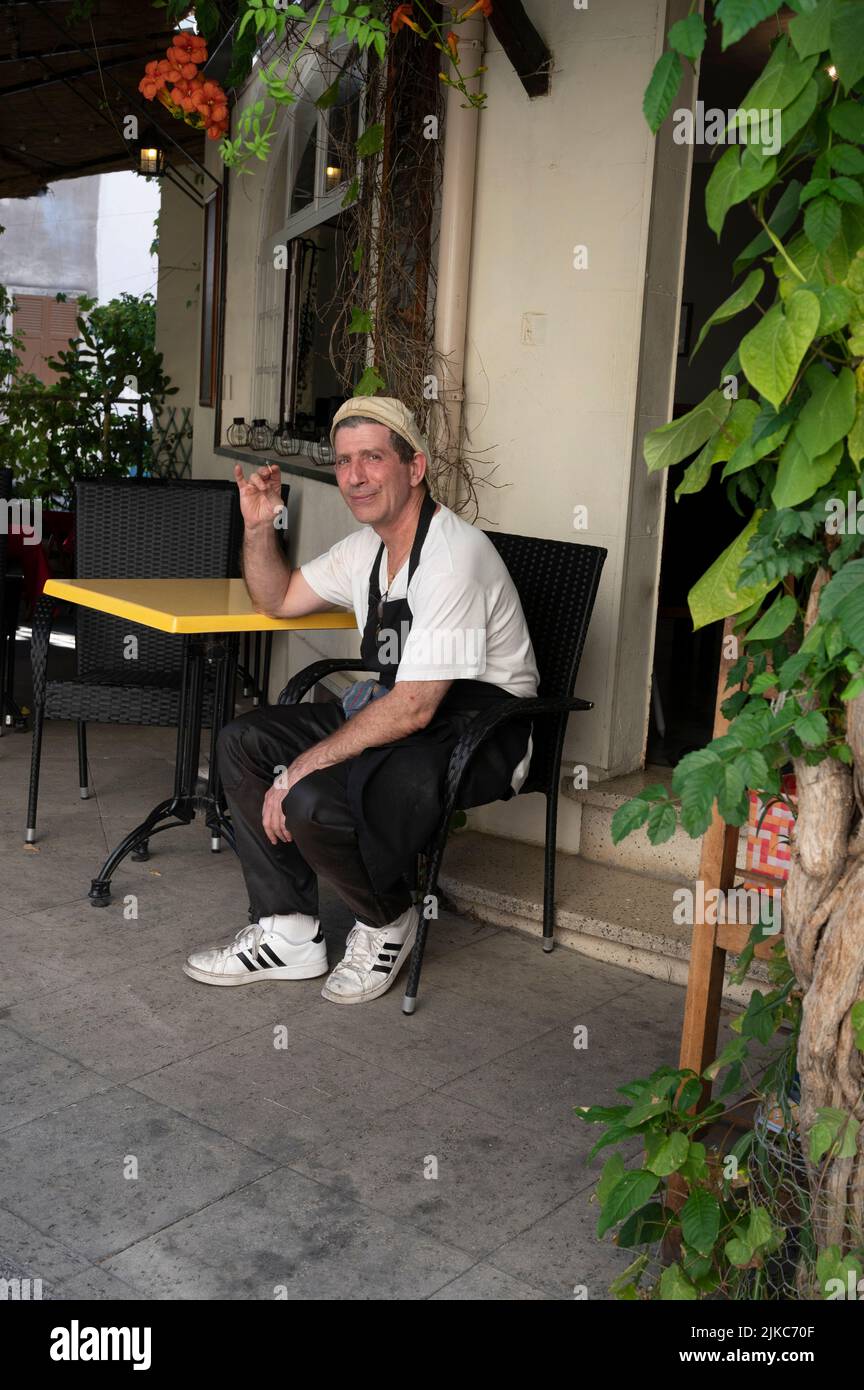 Arles, France. A restaurant cook has a cigarette break Stock Photo - Alamy