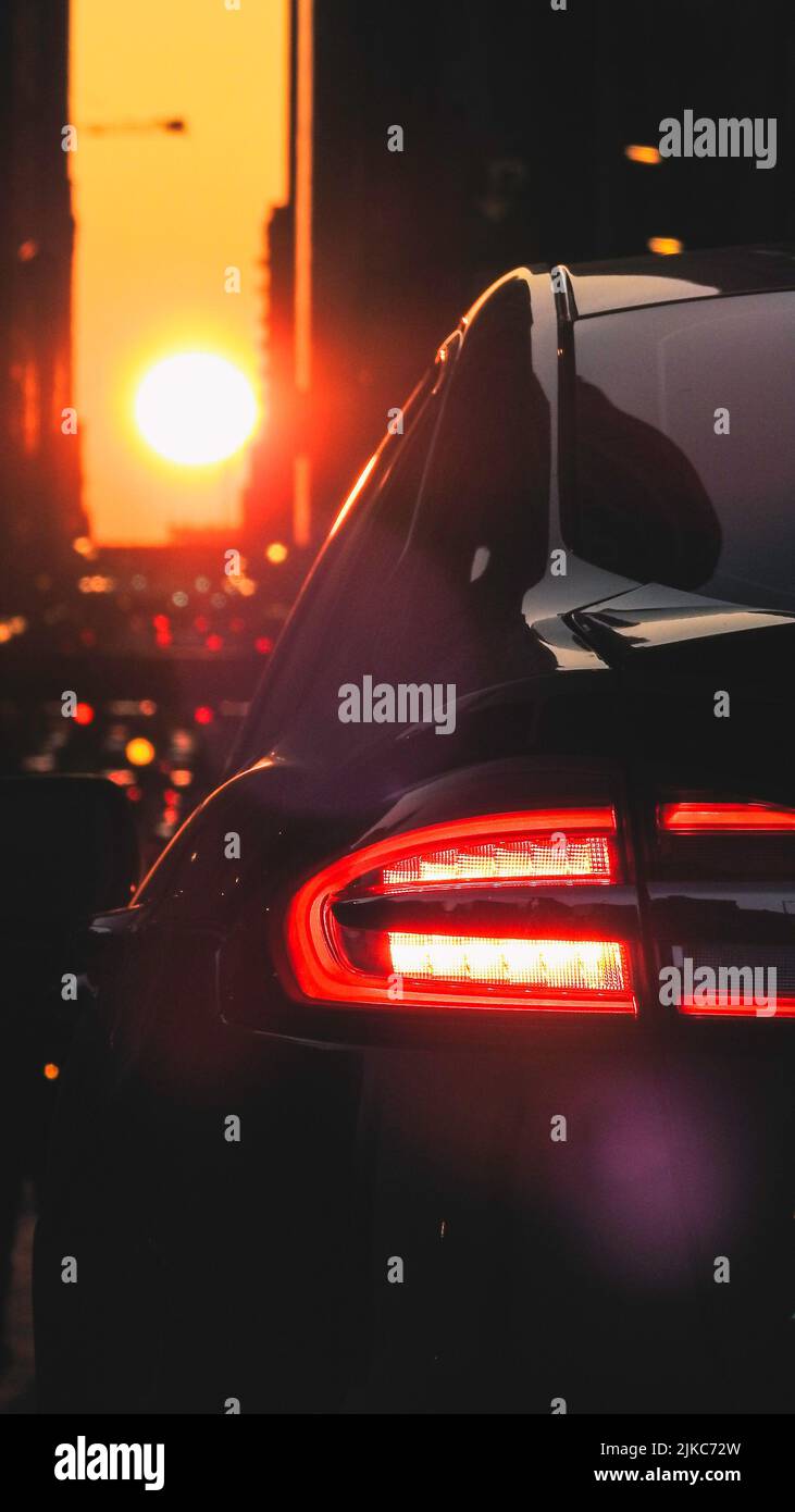 A vertical shot of car against sunset Stock Photo - Alamy