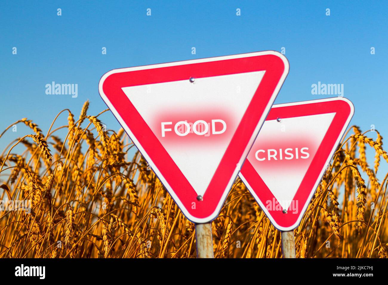 Food crisis concept. Two red road signs. Defocus blank empty triangle ...
