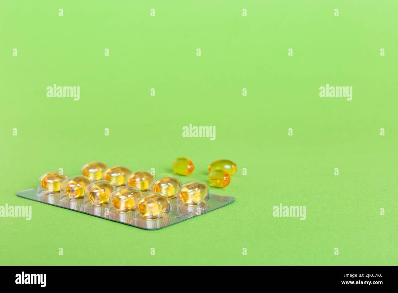 Blister package with fish oil capsules on color background. Medicine ...