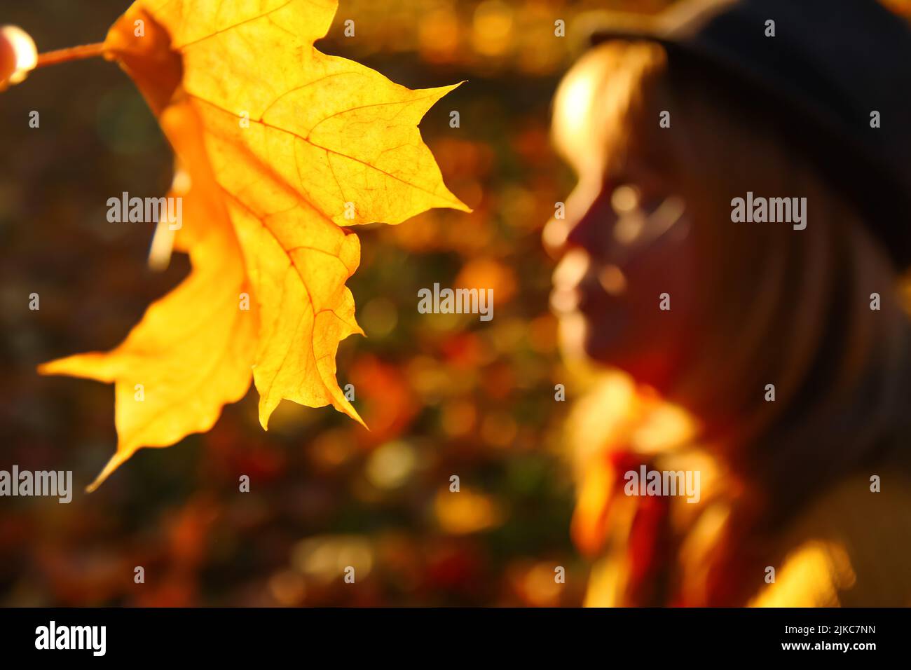 Defocus closeup portrait of smiling young Caucasian blonde woman in ...