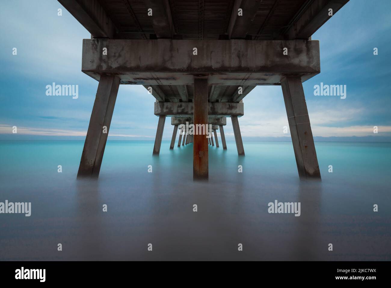 A long exposure and an underneath shot of the sea pier Stock Photo - Alamy