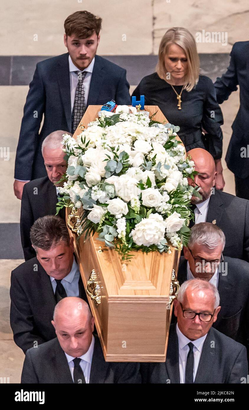 Harry Gration's widow Helen Chene and their son Harvey (left) walk ...