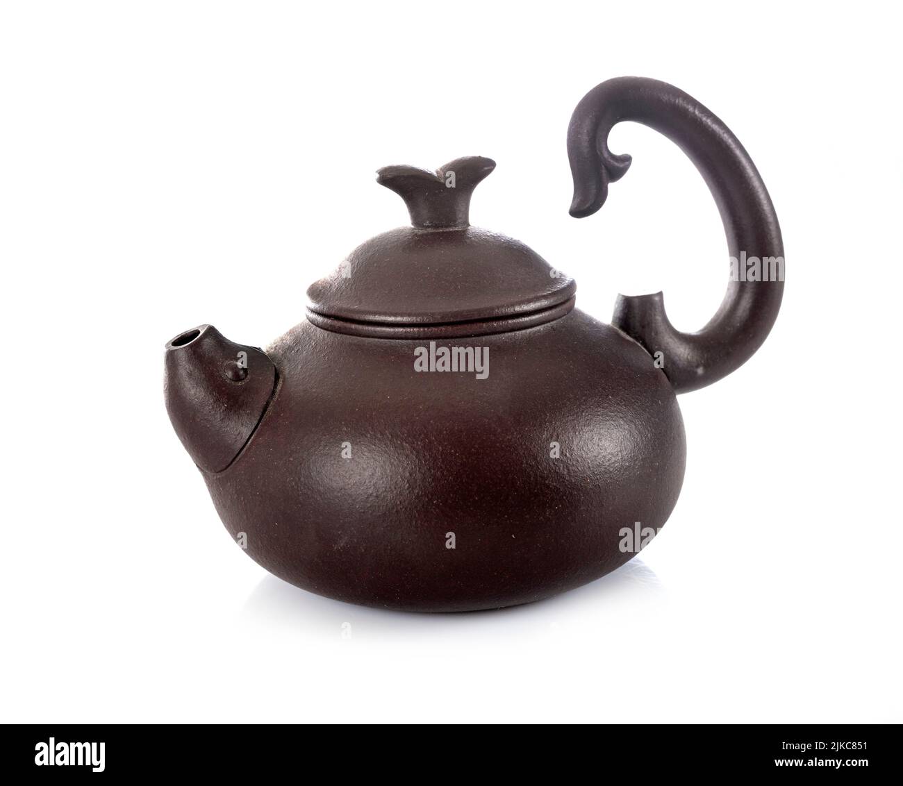 cast iron teapot in front of white background Stock Photo - Alamy