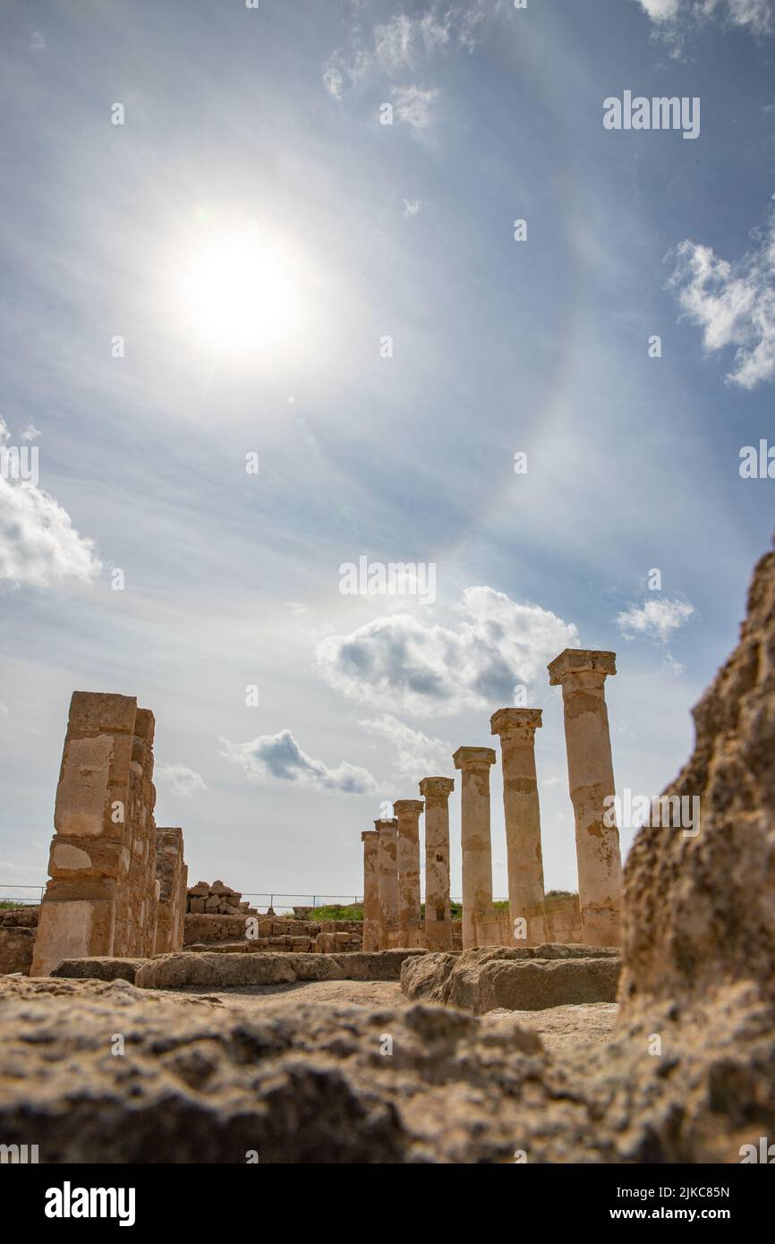 A vertical low-angle shot of columns in the Paphos Archaeological Park ...
