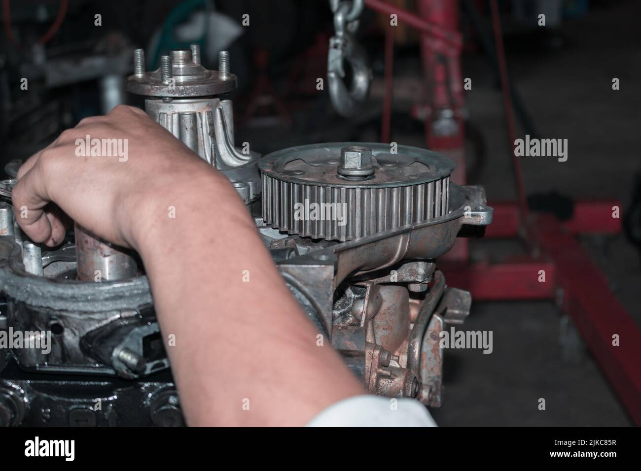 a close up of auto mechanic's hands repairing car troubleshooting with ...